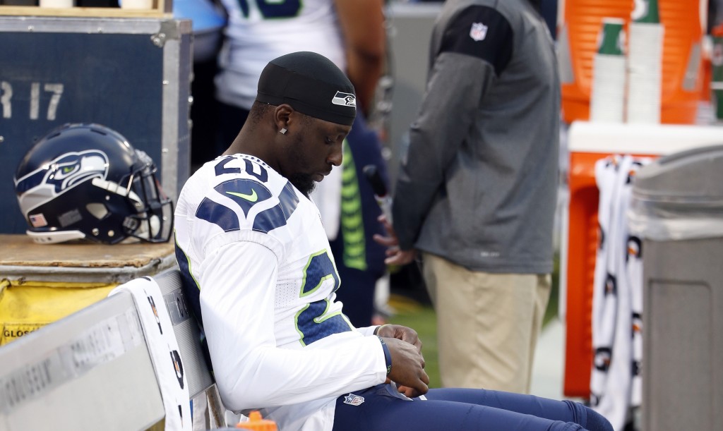 Seahawks' Jeremy Lane sits during national anthem in Oakland