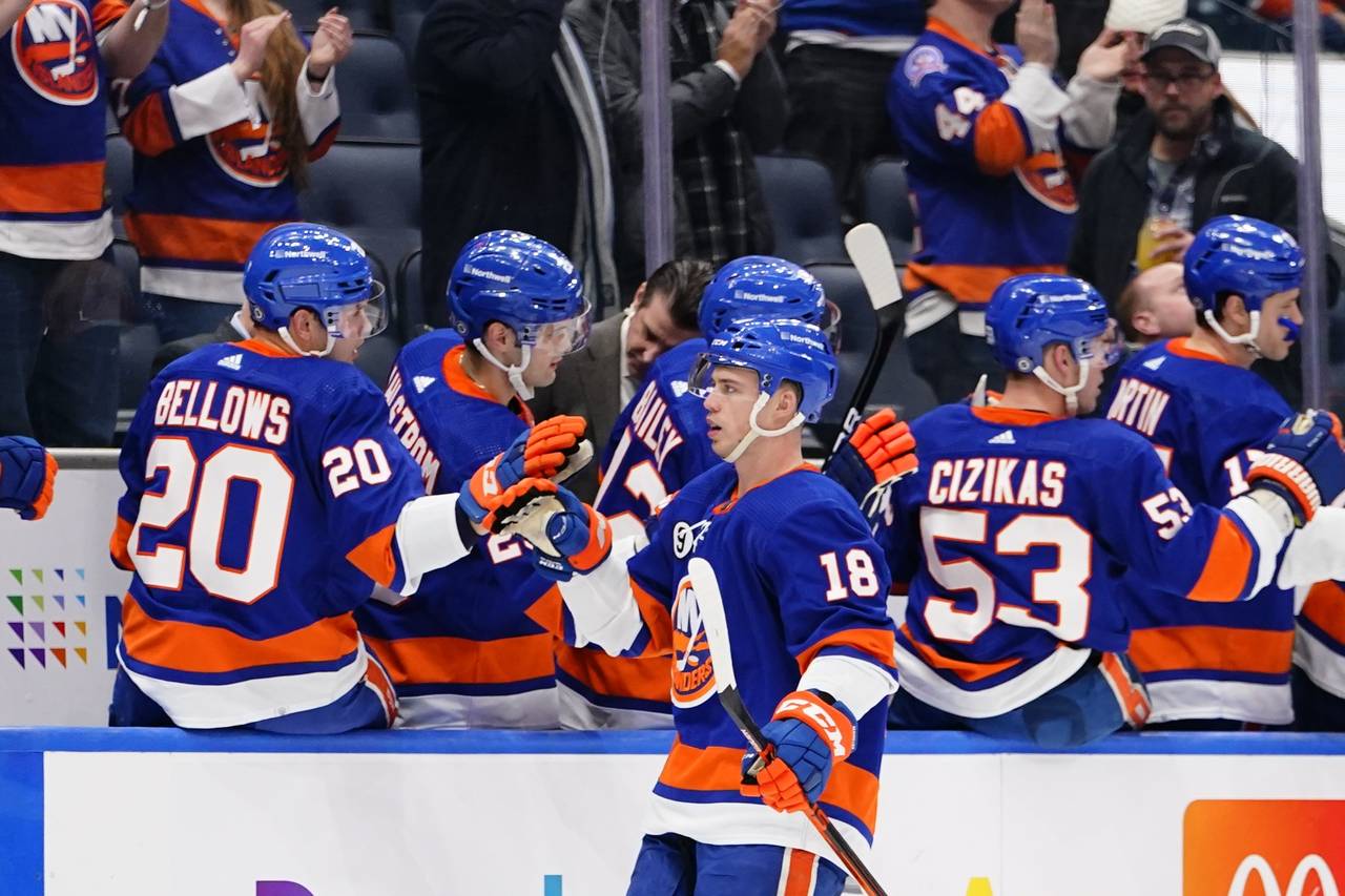 Canucks score twice early in third, rally past Islanders 4-3