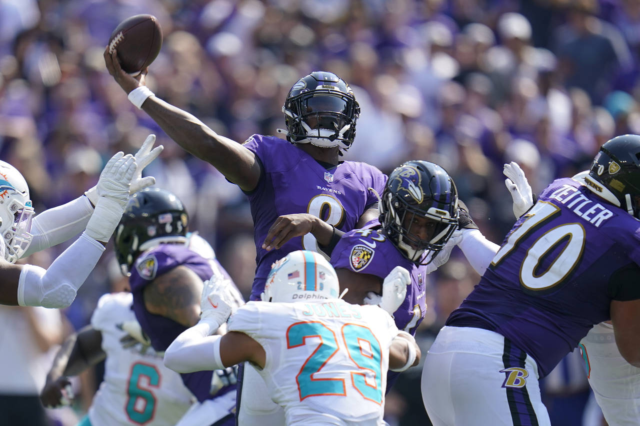 Jackson runs past Vick, effort wasted in brutal Ravens' loss
