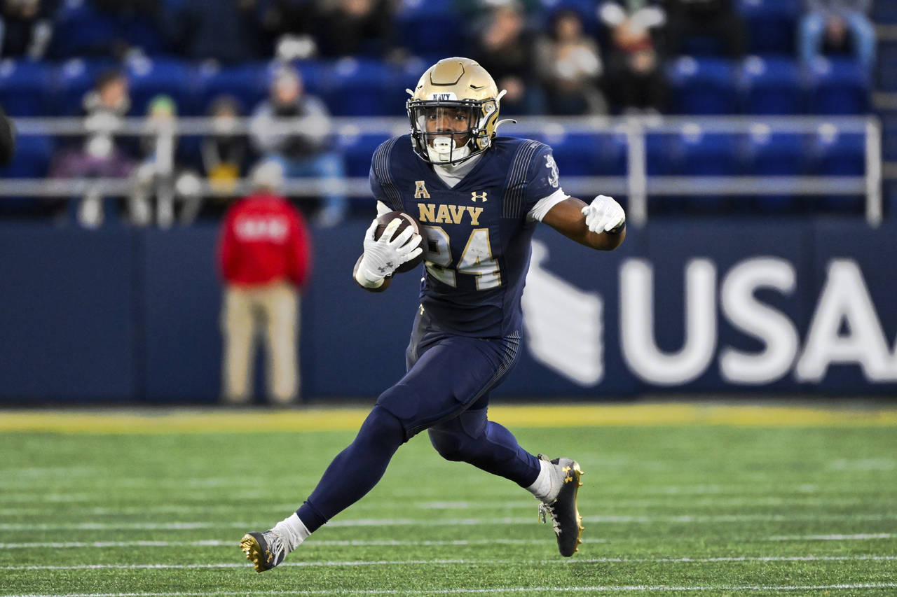 Arline leads Navy past Temple in overtime 27-20