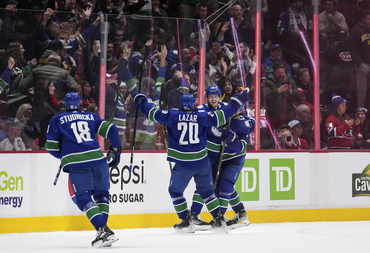 Pettersson scores early in OT, Canucks beat Canadiens 7-6